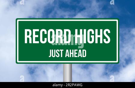 Record Highs just ahead road sign on sky background Stock Photo - Alamy