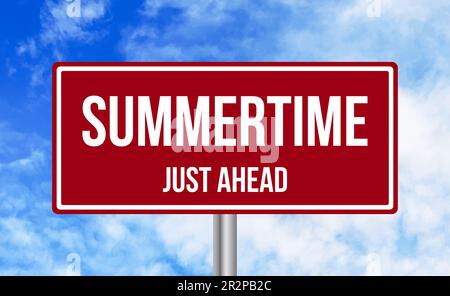 Summertime just ahead road sign on sky background Stock Photo - Alamy