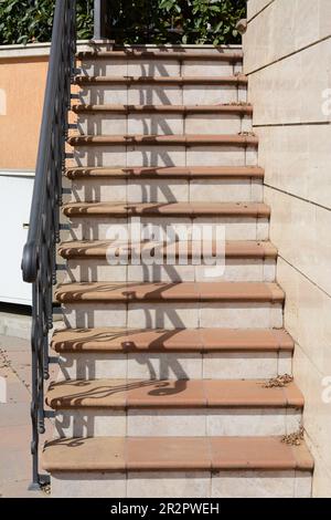 Beautiful tiled stairs with metal railings outdoors Stock Photo - Alamy