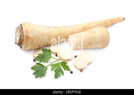 Whole and cut raw parsley roots, fresh herb isolated on white Stock ...