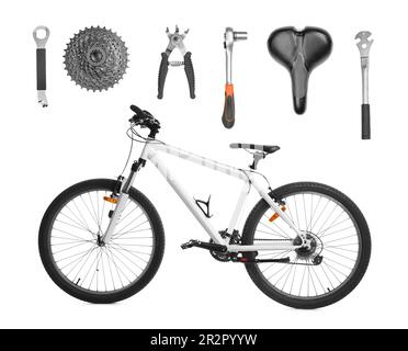 Modern bicycle, its details and tools for repair on white background ...