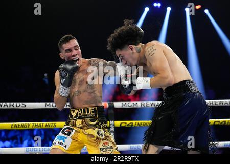 Adam Lopez, right, fights Oscar Valdez in a junior lightweight boxing ...