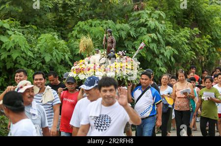 Religious procession in the Philippines : bearers support a statue of a ...