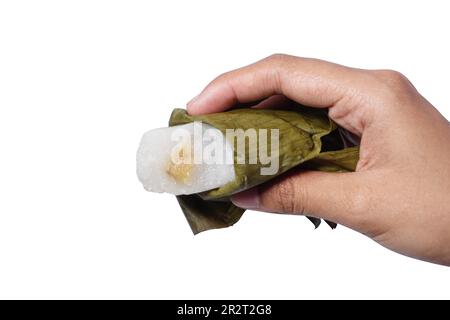 Hand holding nagasari cake. Nagasari is a traditional cake from ...