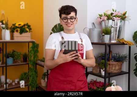 Non binary person using touchpad device at night surprised pointing ...