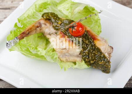Oven Baked rabbit legs with sauce Stock Photo - Alamy