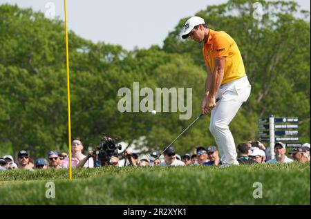Viktor Hovland, of Norway, chips onto the 17th green during the third round of the U.S. Open ...