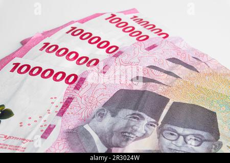 Indonesian banknotes worth IDR 100,000 Rupiah. Rupiah banknotes issued ...