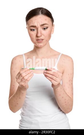 Woman with rash holding thermometer on white background. Monkeypox ...