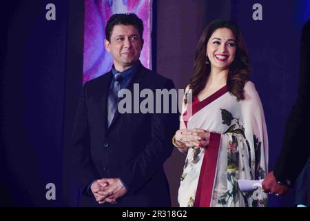 Bollywood actor Madhuri Dixit and her husband Shriram Madhav Nene pose ...