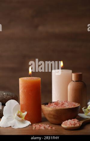 Many burning candles and sea salt on tray Stock Photo - Alamy