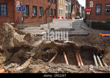 Civil Engineering road works construction workers & machines working ...