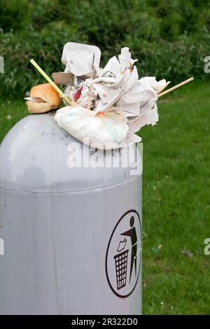 Overfilled trash can Stock Photo - Alamy