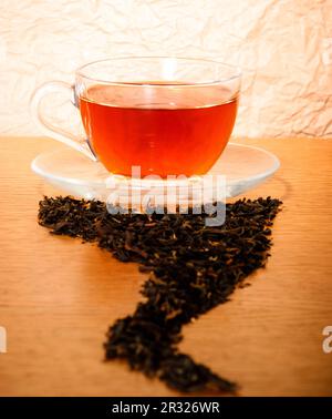 Green tea. Dried tea leaves, Green tea brewed in a cast iron teapot ...