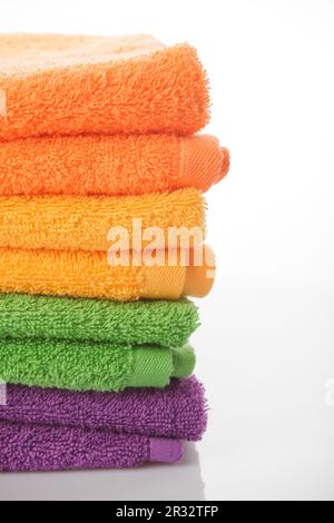 Colorful folded towels stack closeup picture Stock Photo - Alamy