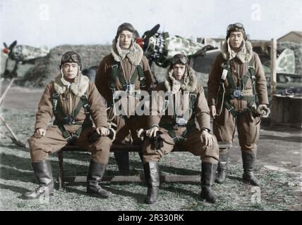 Second World War pilot Sergeant Ray Holmes (2nd R), looks at the engine ...