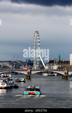 Thames clipper water bus in Tower Hamlets urban landscape & Pool of ...