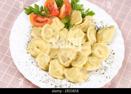 Pelmeni - traditional russian dish. Preparation, selective focus Stock ...