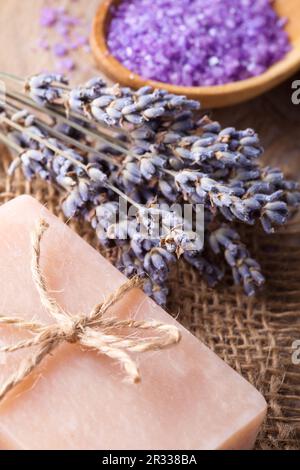 Spa products and lavender flowers. Aromatherapy lavender bath salt and ...
