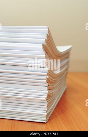 Stack of white journals Stock Photo - Alamy
