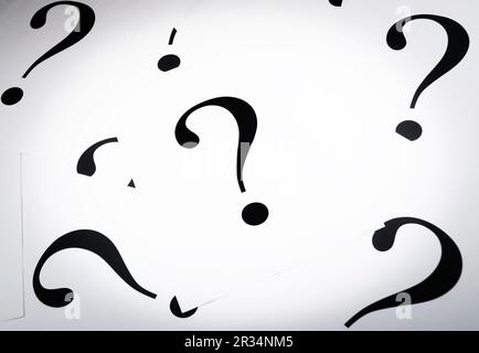 Printed question marks on the white paper Stock Photo - Alamy