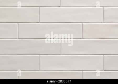 White smooth long thin horizontal tile pattern on a wall, background ...