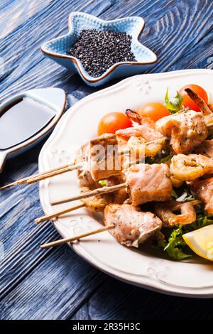 Grilled shish kebab with seafood, shrimp, octopus, squid and mussels ...