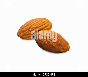 Close up photograph of shelled almonds in a white bowl, on a white ...