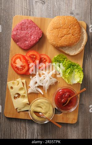 Cheeseburger ingredients, top view. From above, overhead, flat lay ...