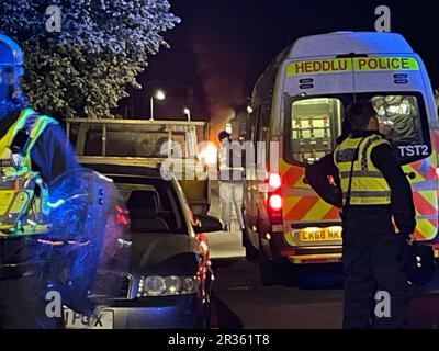Police officers on Howell Road in Cardiff as they face a "large scale ...