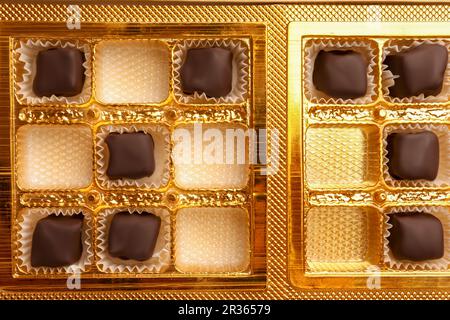 Partially empty box of chocolate candies as background, top view Stock ...