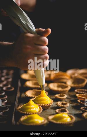 A baking tray filled with many cookie cutters and various other baking ...