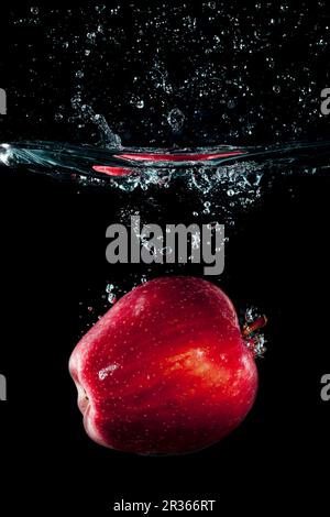 apple falling in the water Stock Photo - Alamy
