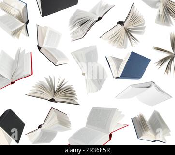Many hardcover books falling on white background Stock Photo - Alamy
