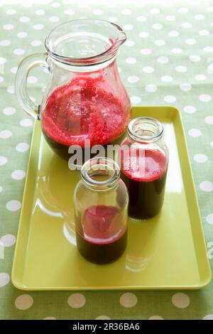 glass jar of beetroot juice on white background Stock Photo - Alamy