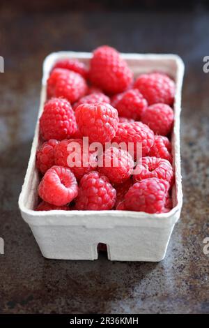 Raspberries in a paper punnet Stock Photo - Alamy