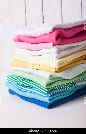 Stack of neatly folded baby clothes Stock Photo - Alamy