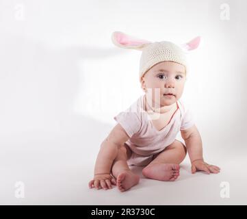 Baby girl in a rabbit hat Stock Photo - Alamy