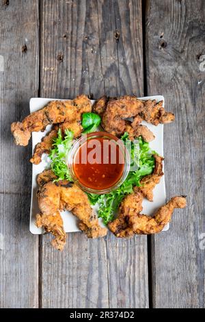 Deep fried frog legs Stock Photo - Alamy
