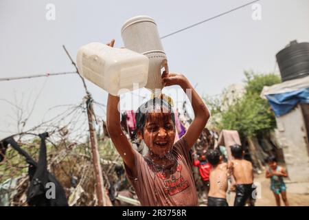 A young girl plays in the slums of Anarba, one of the poorest slums of ...