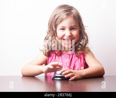 Girl push on the bell Stock Photo - Alamy