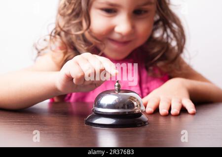 Girl push on the bell Stock Photo - Alamy