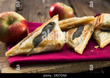 Apple turnovers with sage leaves Stock Photo - Alamy