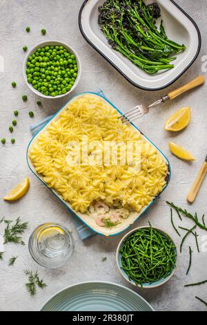 Fish pie from side. Fish pie with potato and herbs served with olive ...