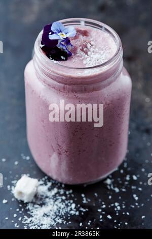 Edible flowers on smoothie Stock Photo - Alamy