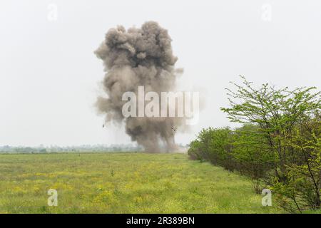 Controlled explosion of unexploded munition collected by de-mining unit ...