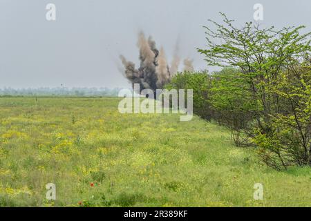 Controlled explosion of unexploded munition collected by de-mining unit ...