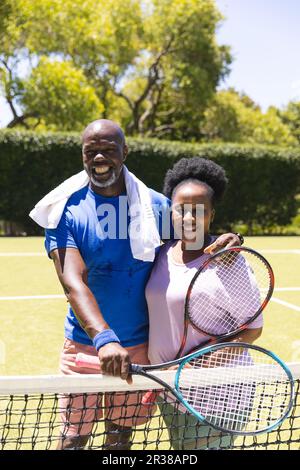 Tennis, fitness and portrait of couple with smile standing on court in ...