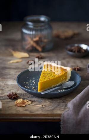 Pumpkin Pie Slice with Autumn Drink and Festive Table Decor Stock Photo ...