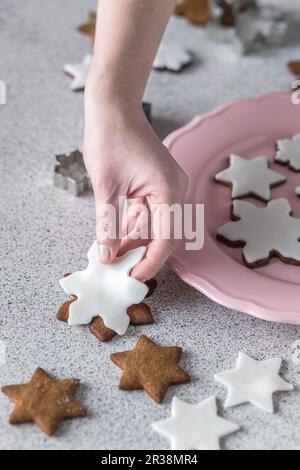 Traditional gingerbread biscuits topped with white glaze Stock Photo ...